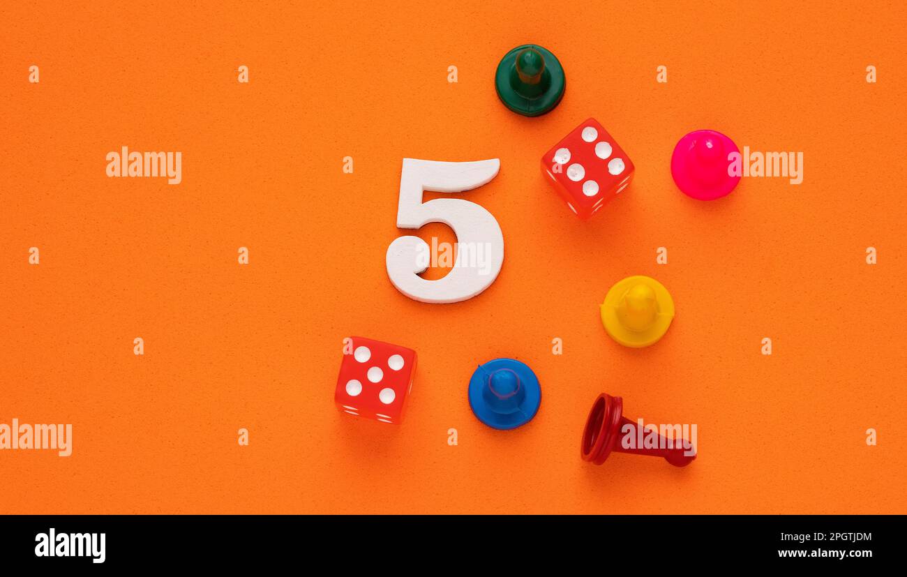 Number 5 with dice and board game pieces - Orange eva rubber background ...