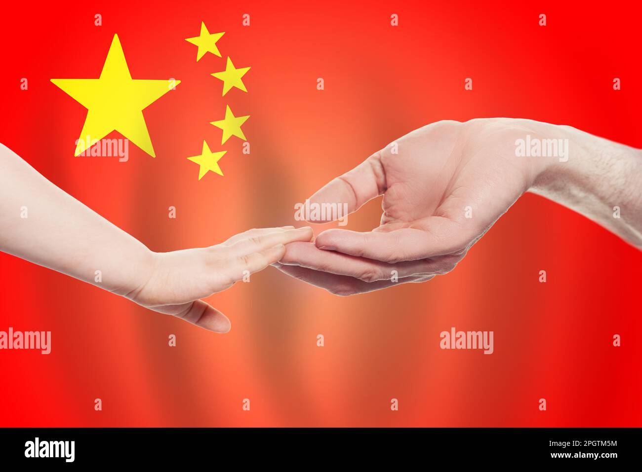 Chinese baby and parent hands on the background of flag of China Help ...