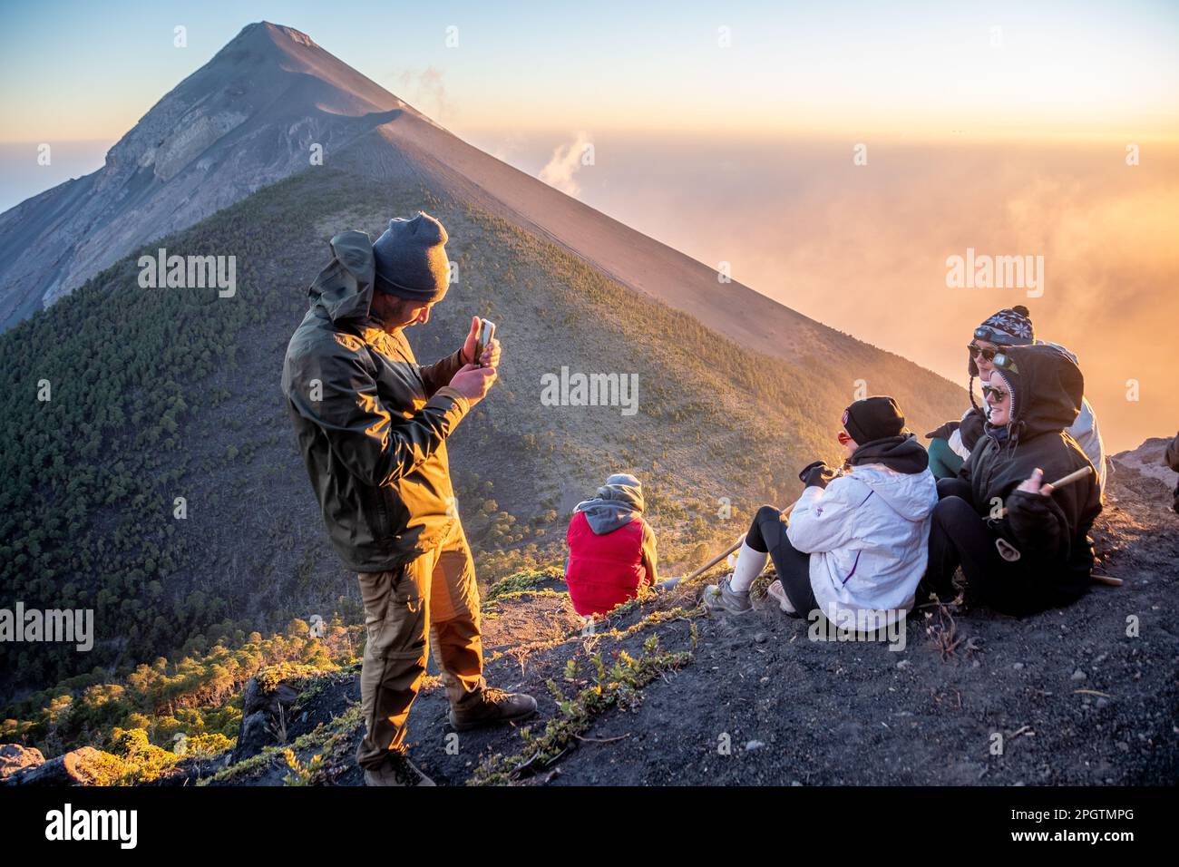 People hiking Fuego volcano in Guatemala Stock Photo - Alamy