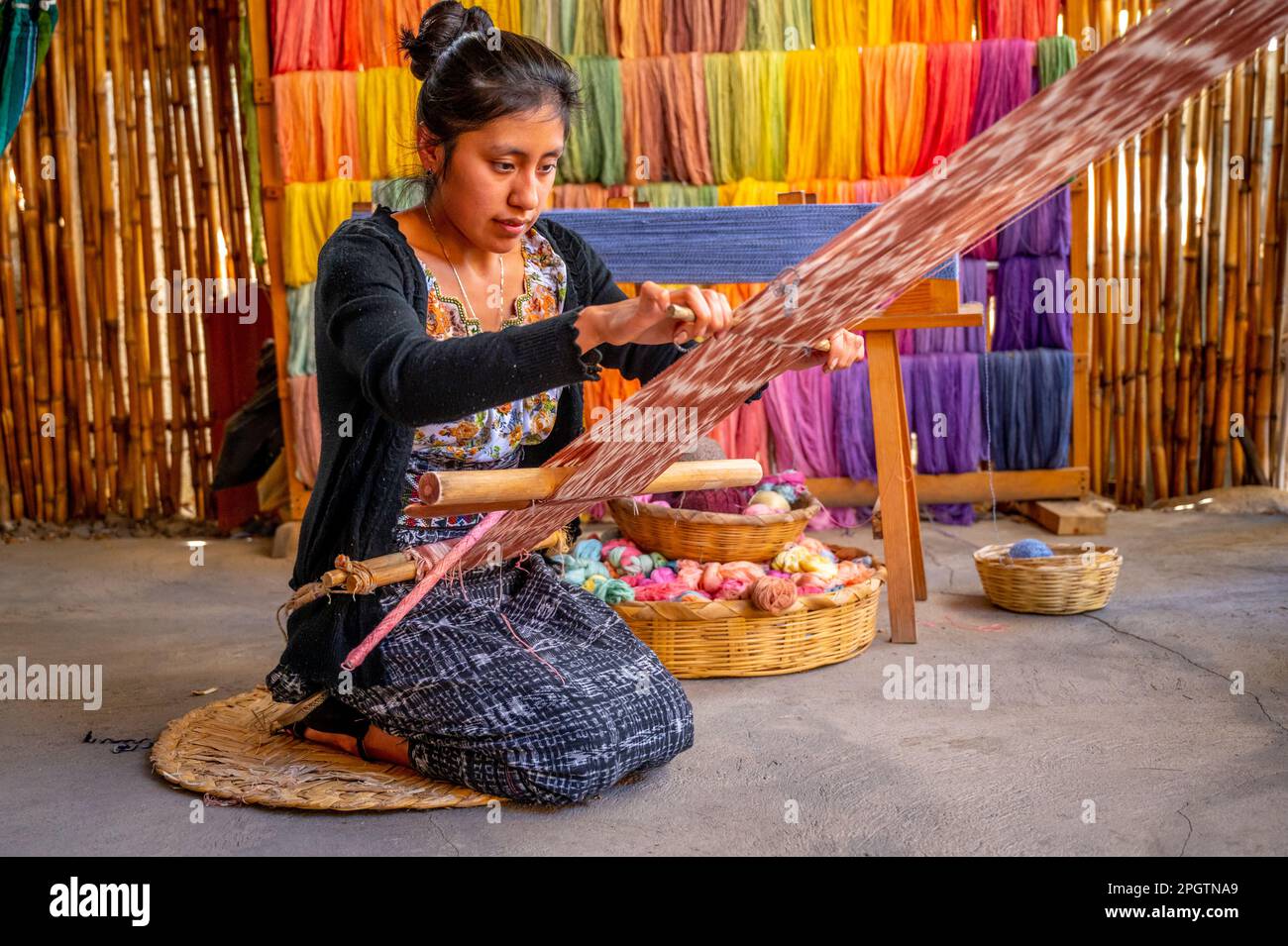 Guatemalan Woman explaining how textiles are made in San Juan la Laguna ...