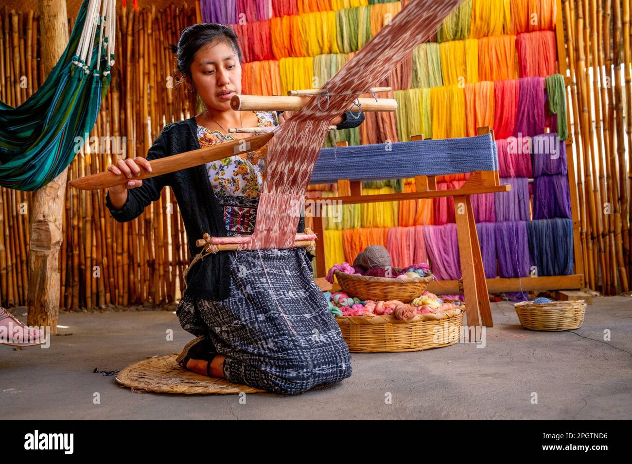 Guatemalan Woman explaining how textiles are made in San Juan la Laguna ...