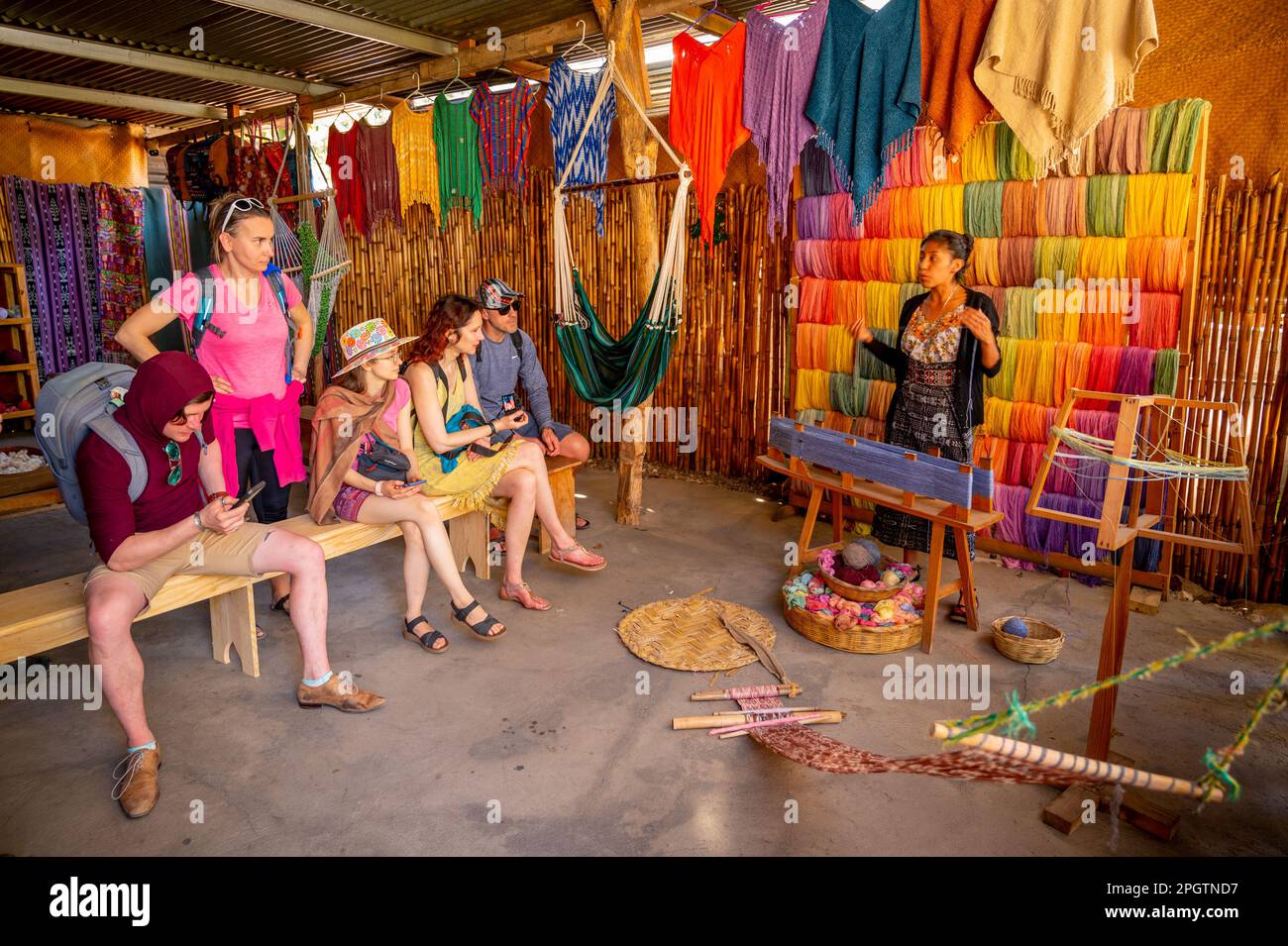 Guatemalan Woman explaining how textiles are made in San Juan la Laguna ...