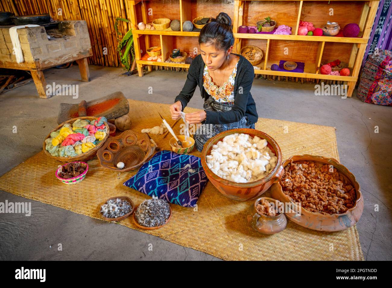 Guatemalan Woman explaining how cotton turns into thread in San Juan la ...