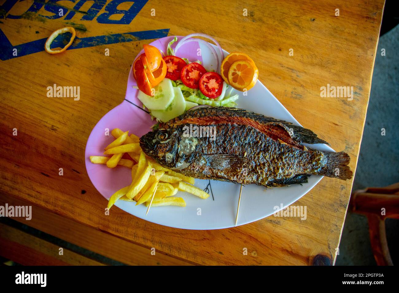 Grilled Mojarra fish on a plate Guatemala Stock Photo - Alamy