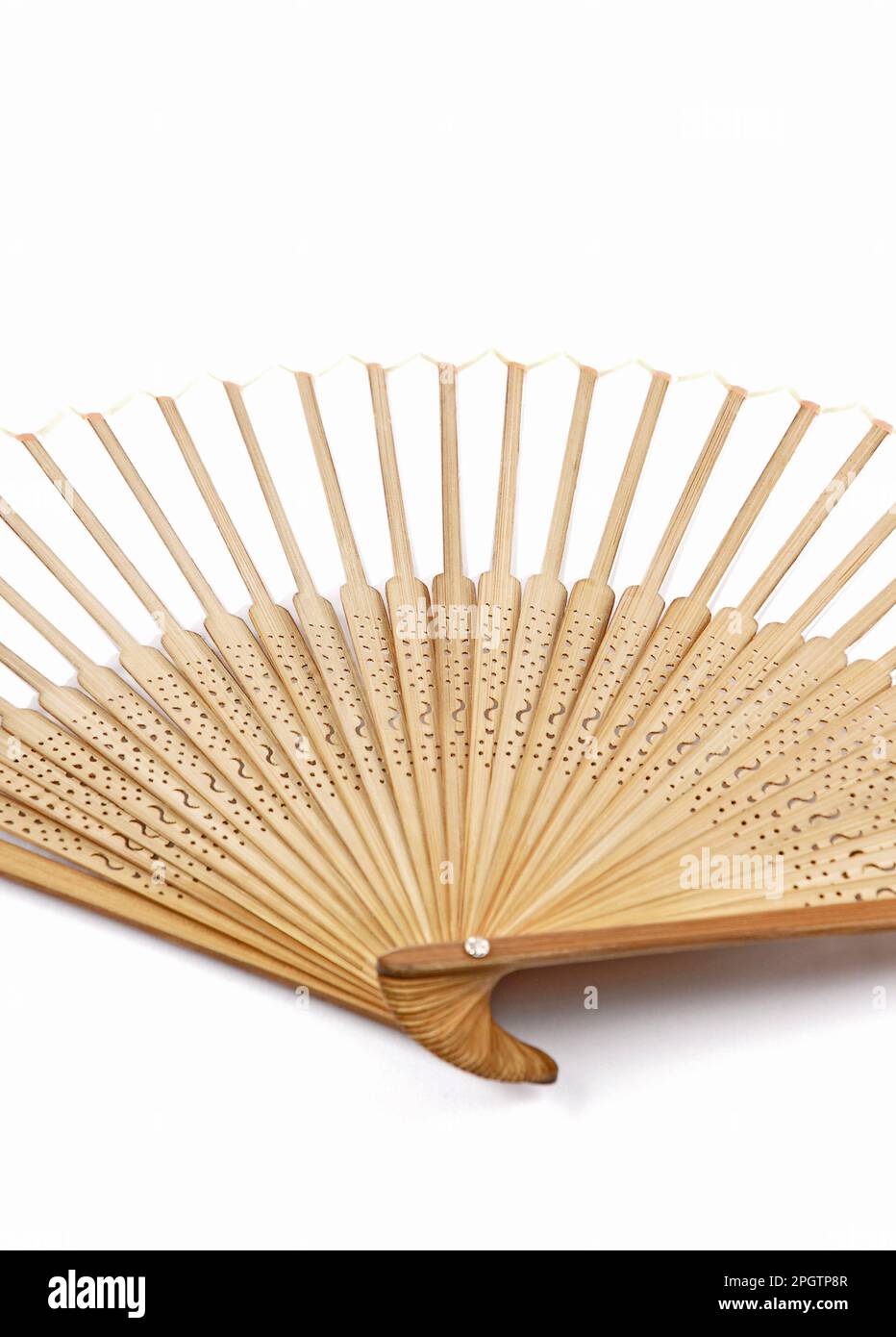 Detail of a hand held fan out of bamboo on a white background Stock ...
