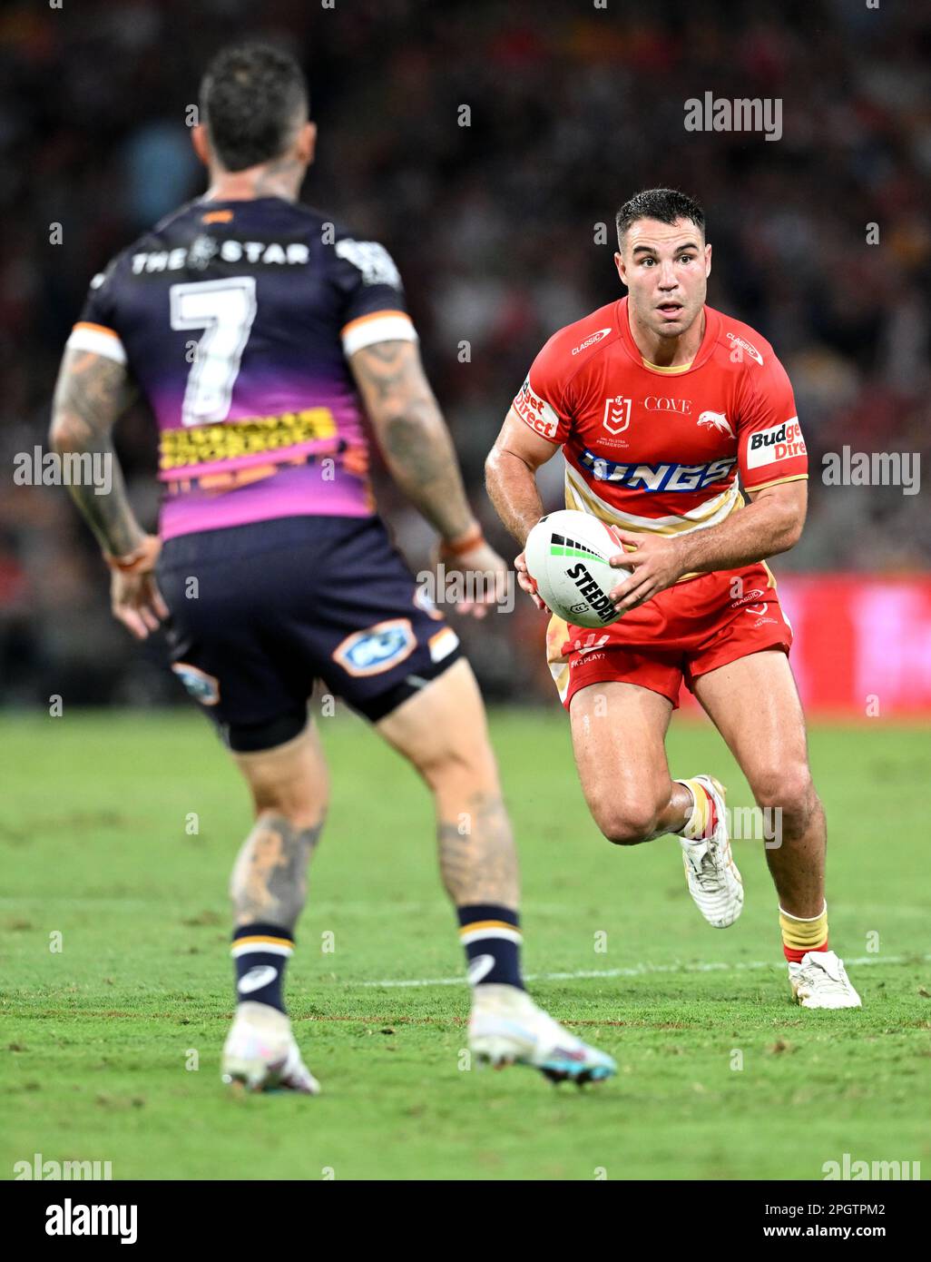 Sean O'Sullivan (right) of the Dolphins takes on Adam Reynolds (left ...