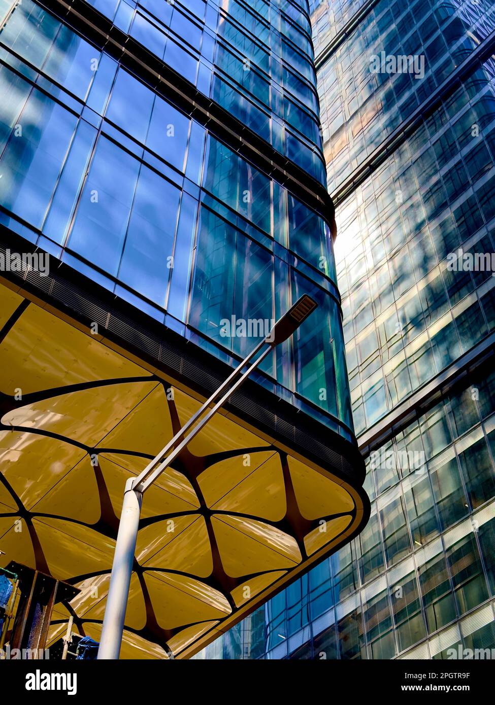 This high-rise building features an abundance of windows along its ...