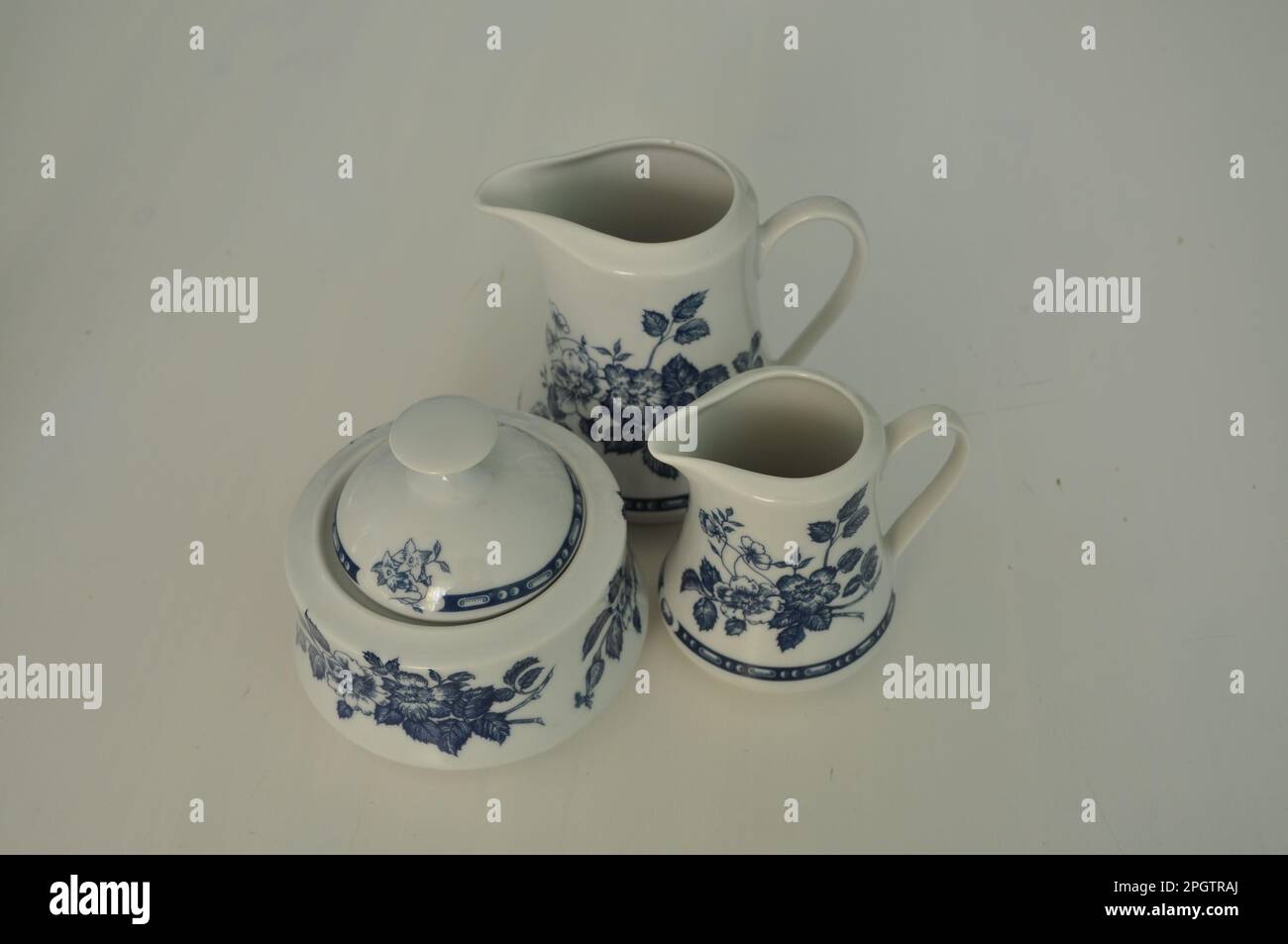 Complete set of milk and sugar service on a white background. Beautiful ...