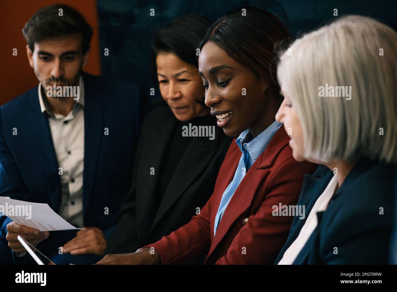Group of multiracial business people in formal outfits sitting n Stock ...