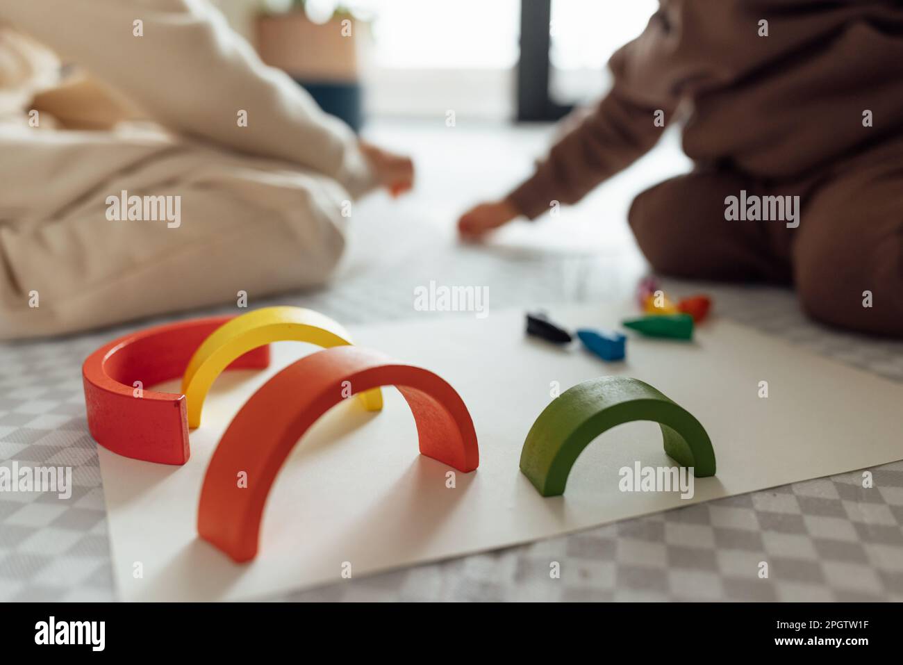 Little caucasian siblings drawing together on floor in living room at ...