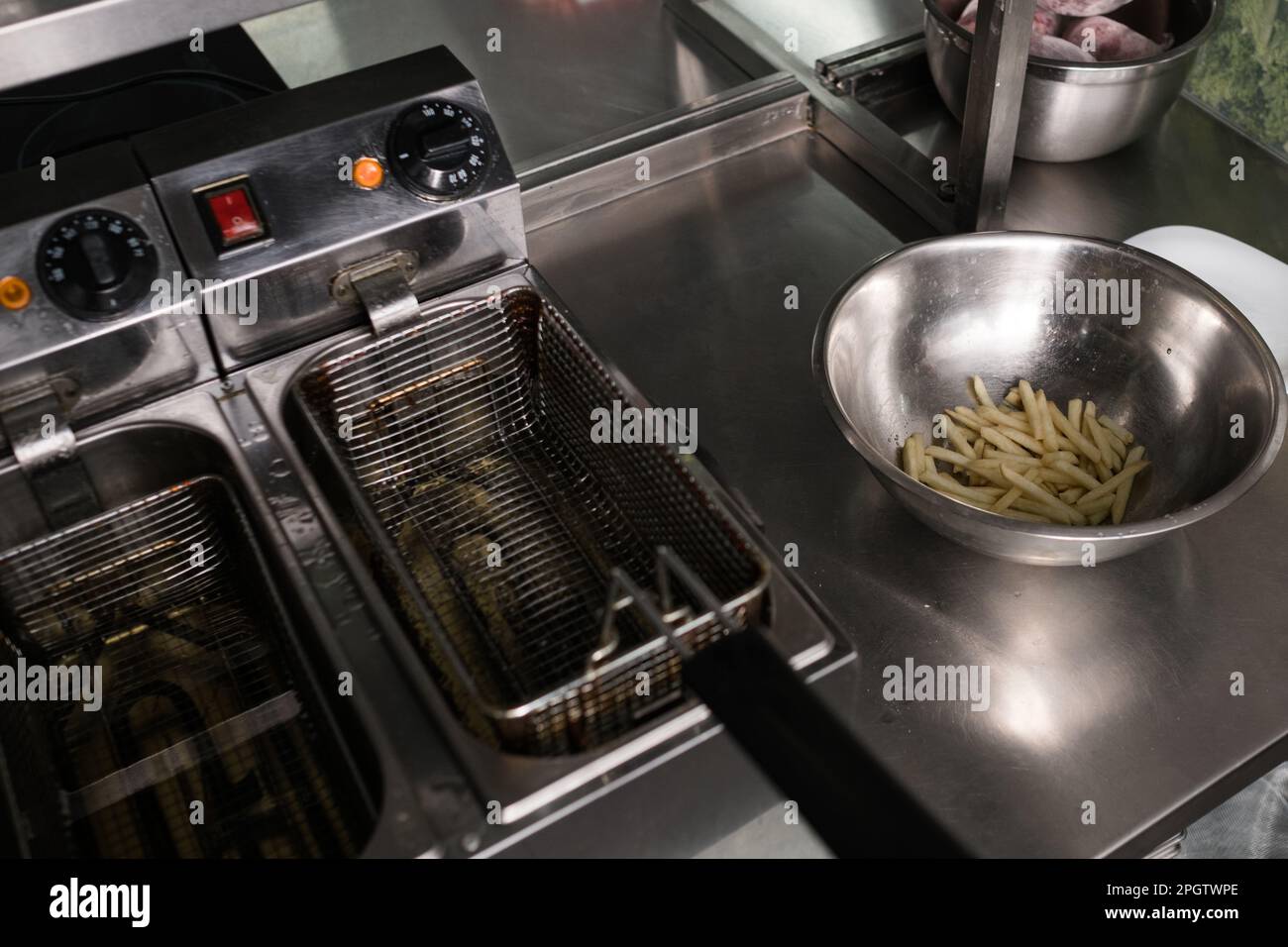 fast food preparing french fries unhealthy eating Stock Photo - Alamy