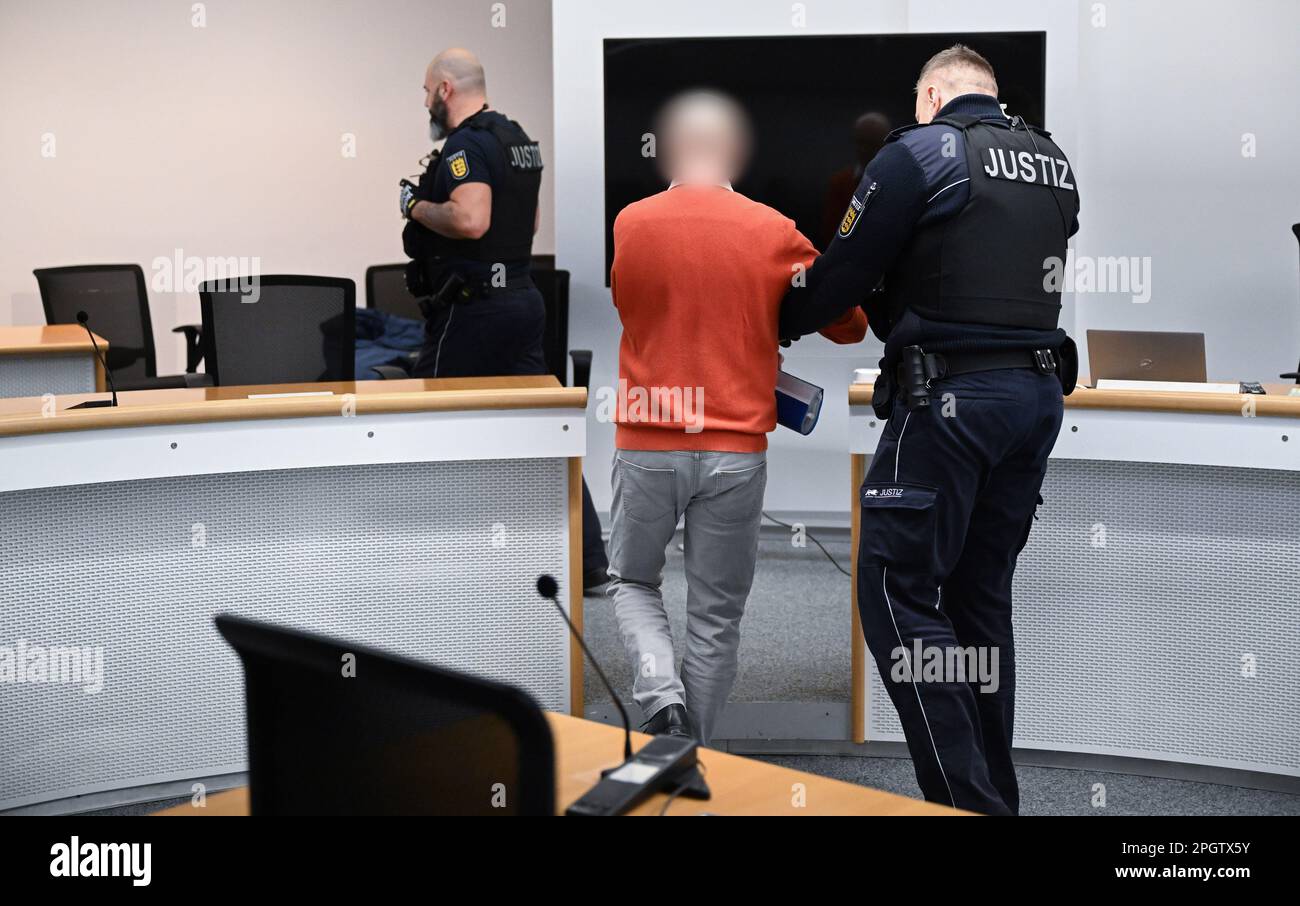 Stuttgart, Germany. 24th Mar, 2023. The defendant (M) is led into a ...