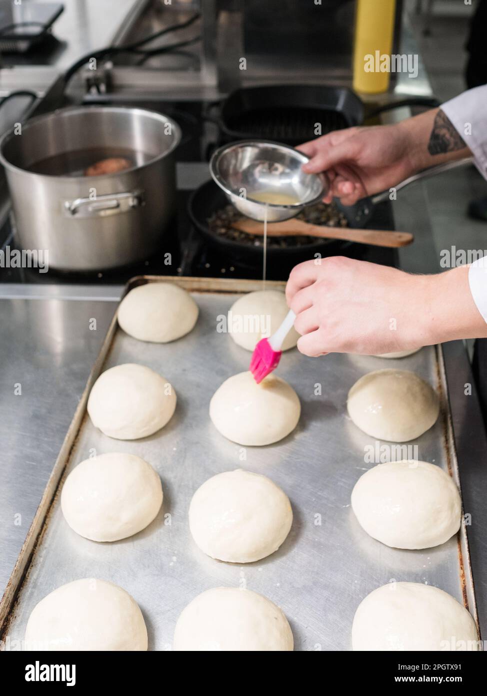 hamburger rolls cook greasing baking Stock Photo - Alamy