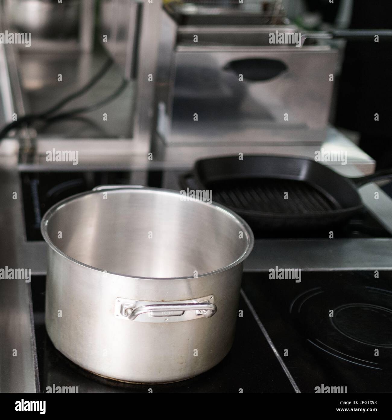 saucepan kitchen utensils professional restaurant Stock Photo - Alamy