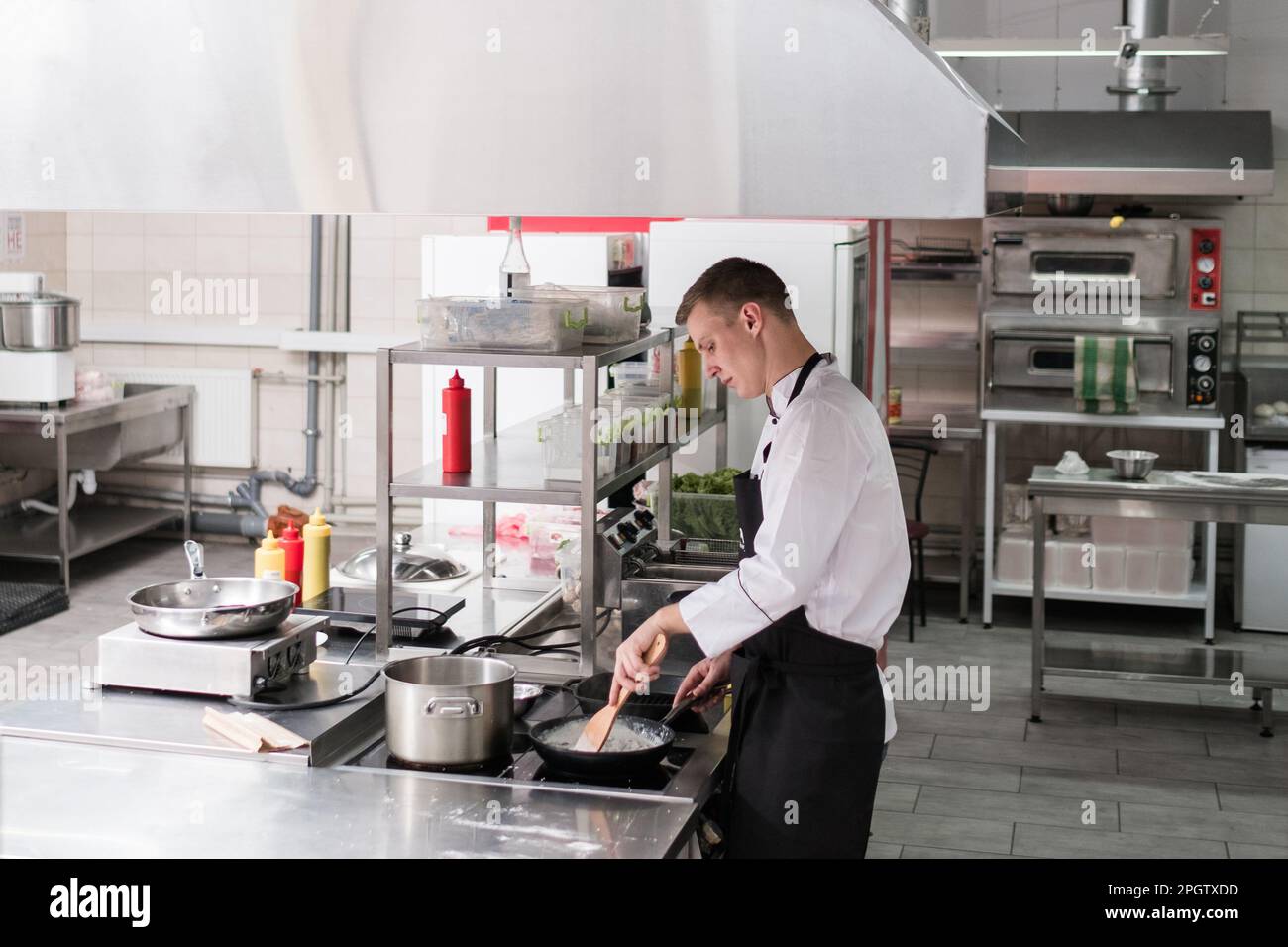 restaurant kitchen interior workspace clean tidy Stock Photo - Alamy