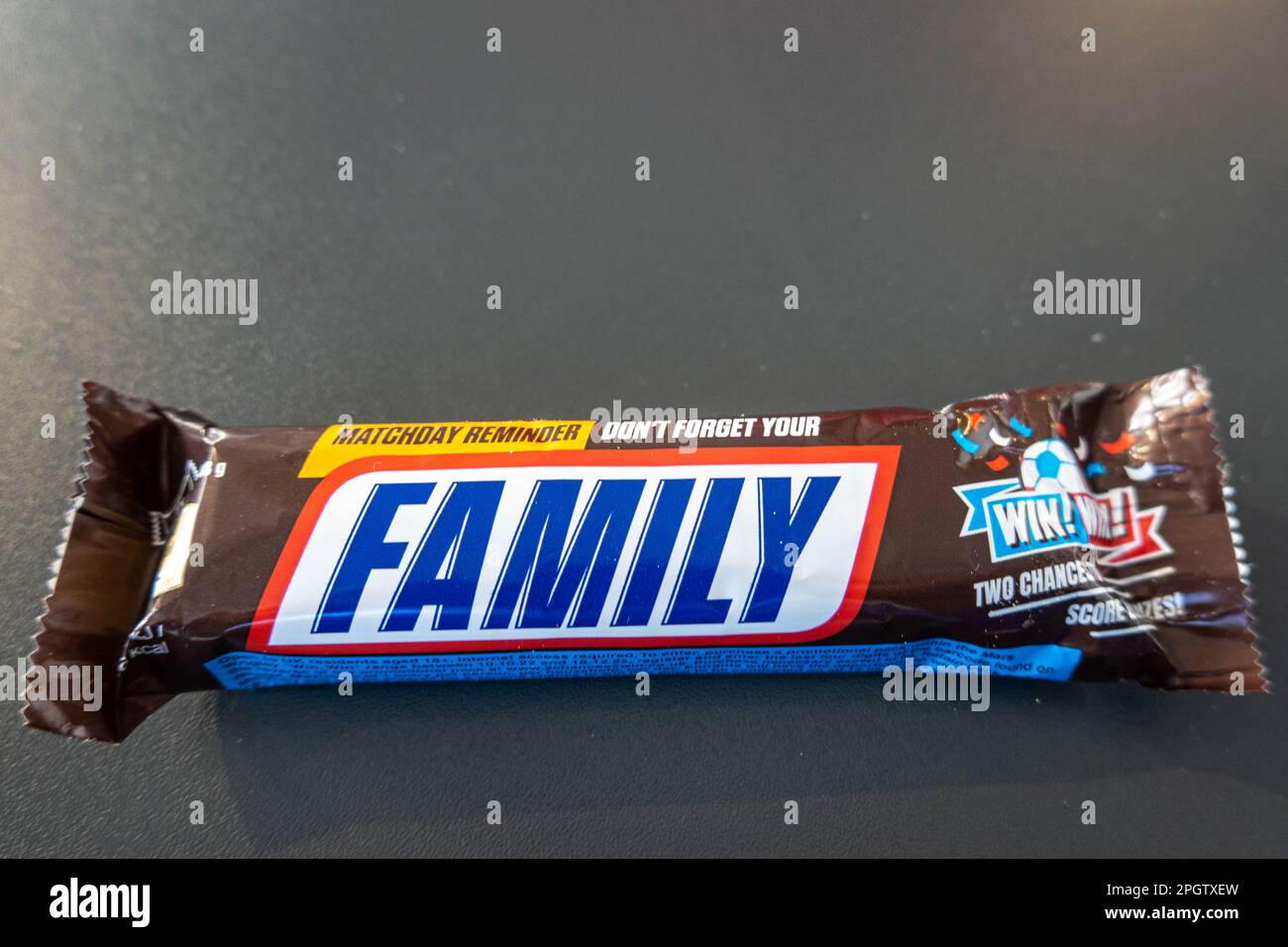 A Snickers bar of chocolate with the word Family on front instead of ...