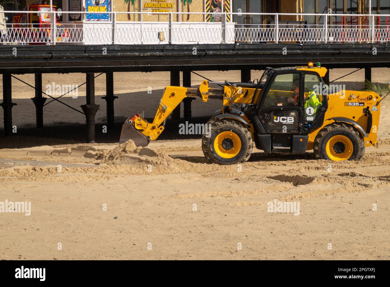 Diggers on Great Yarmouth beach moving sand away from sea walls after ...