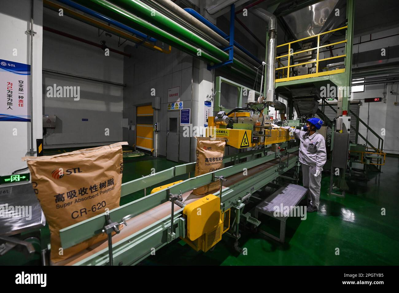 (230324) -- HANGZHOU, March 24, 2023 (Xinhua) -- A worker works at an ...