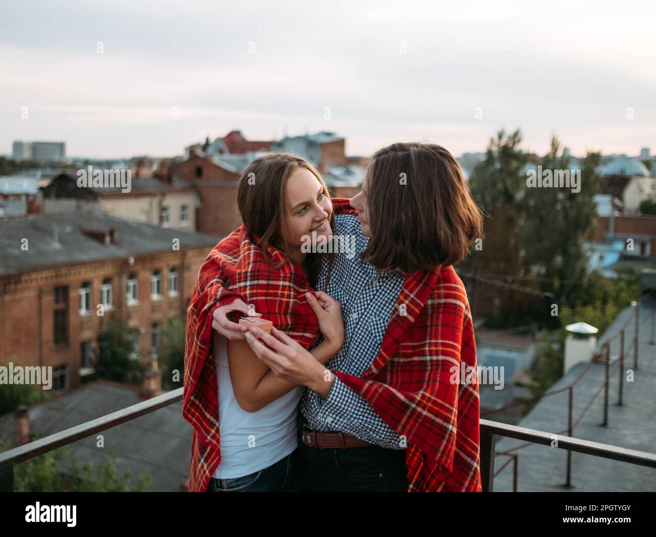 love couple rooftop hug happiness emotion Stock Photo - Alamy