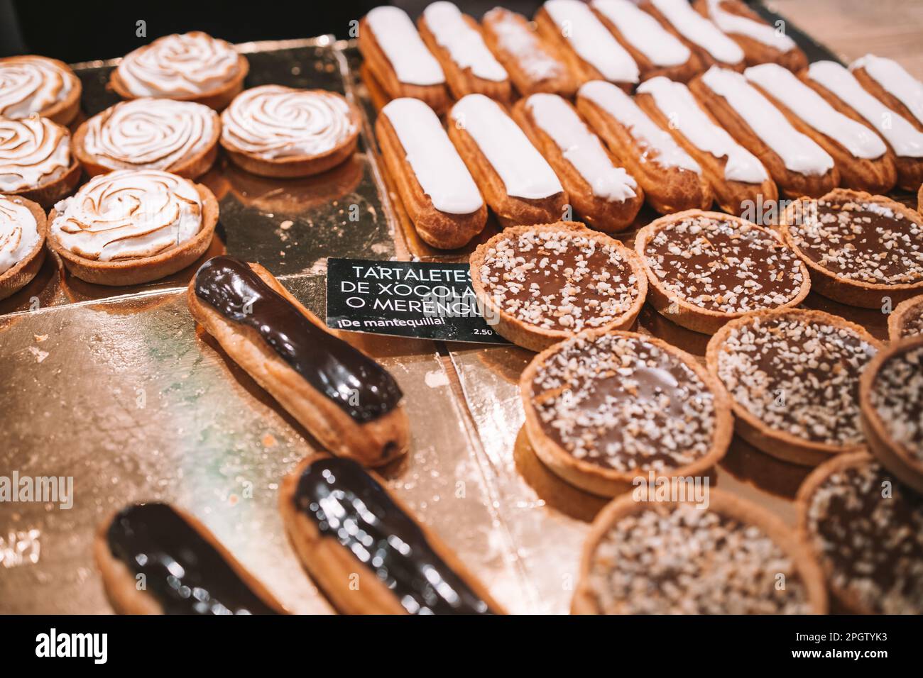 Different types of delicious cakes in pastry shop showcase Stock Photo ...