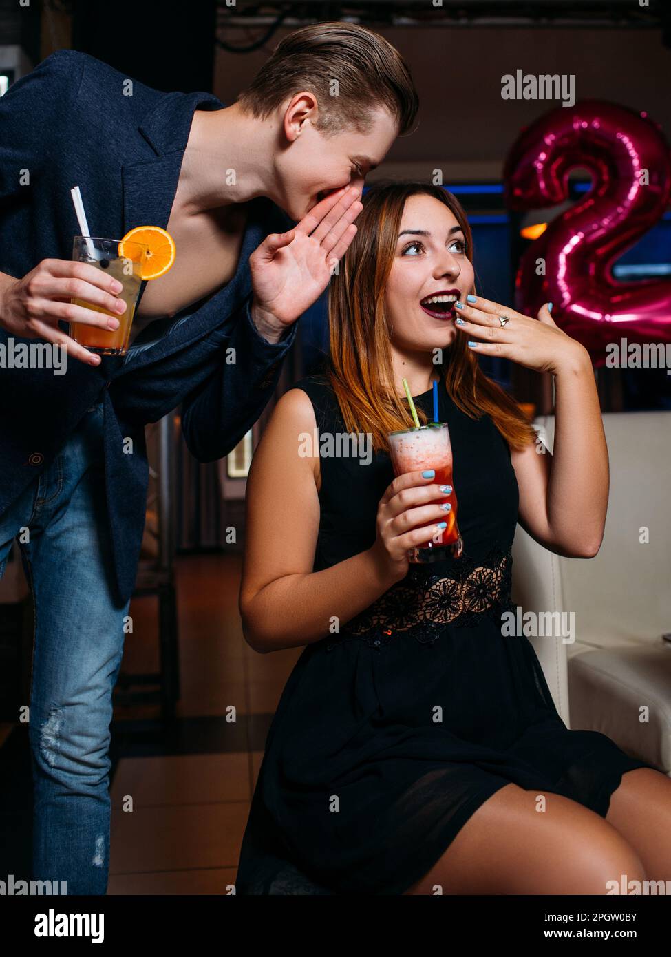 Funny gossips. Playful communication at party Stock Photo - Alamy