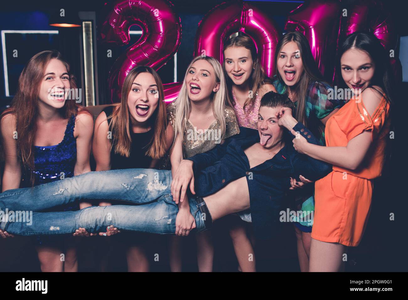 New Year happy celebration. Funny friends Stock Photo - Alamy
