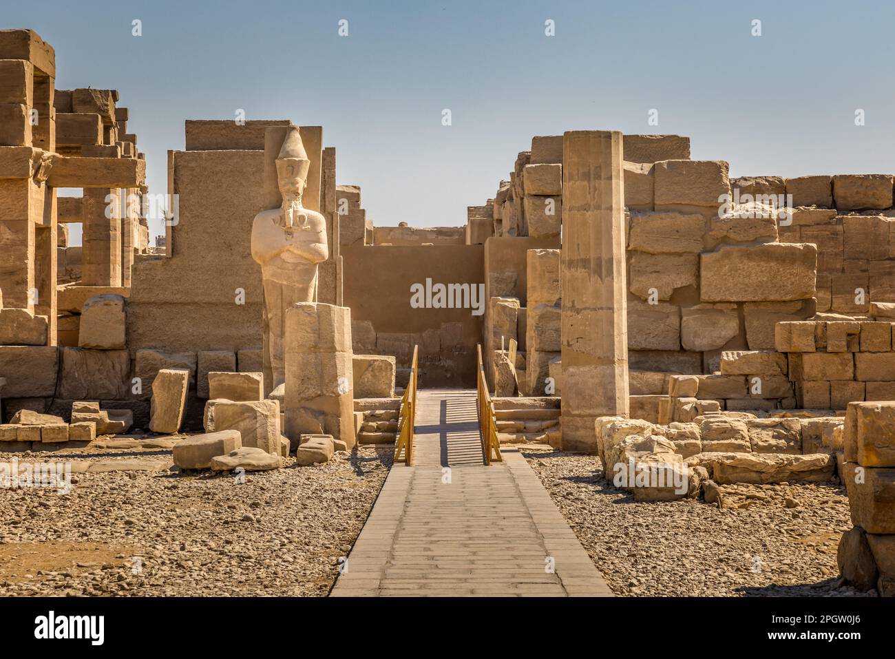 Entrance of a temple with a statue in Karnak, Luxor Egypt Stock Photo ...