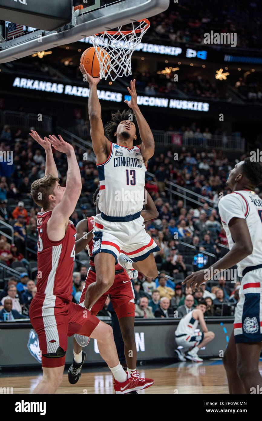 Connecticut Huskies forward Richie Springs (13) scores against Arkansas ...