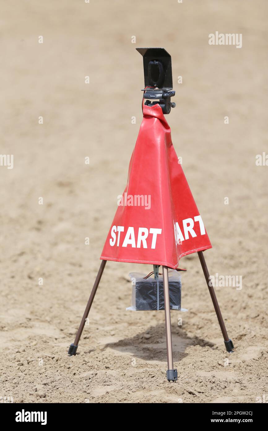 Start sign in the sand on show jumping race track at equestrian centre ...