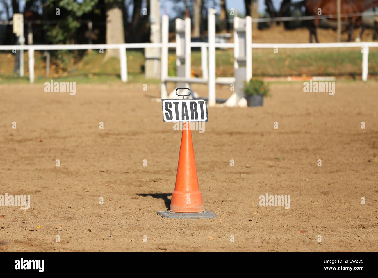 Start sign in the sand on show jumping race track at equestrian centre ...