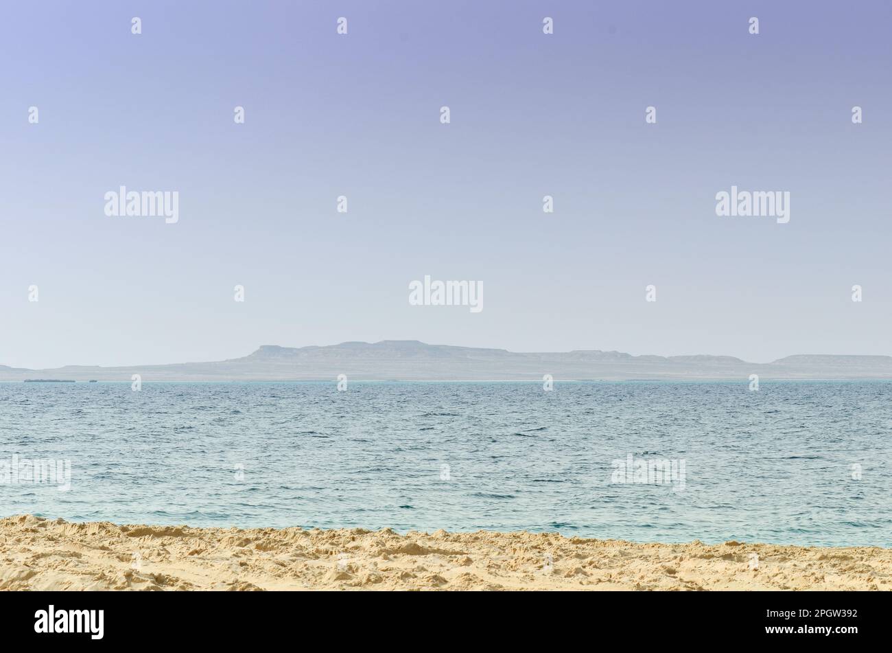 Inland sea at Al-Adaid Desert in Qatar with limestone hills in the ...