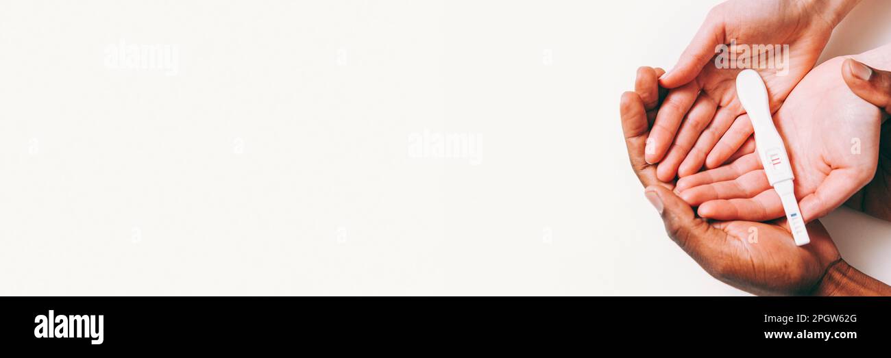 interracial parenthood happy expectation couple Stock Photo - Alamy