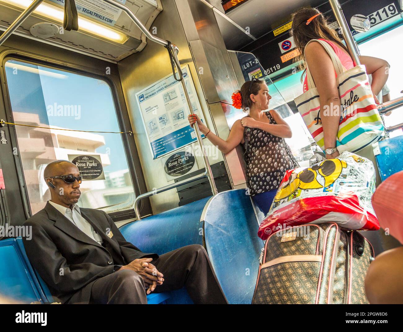 Miami, USA - August 18, 2014: people in the downtown Metro bus in Miami ...