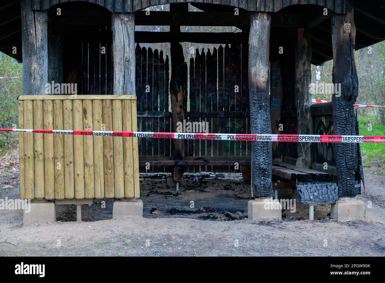 Arson crime scene of a burnt hut cordoned off with german police barrier tape Stock Photo - Alamy