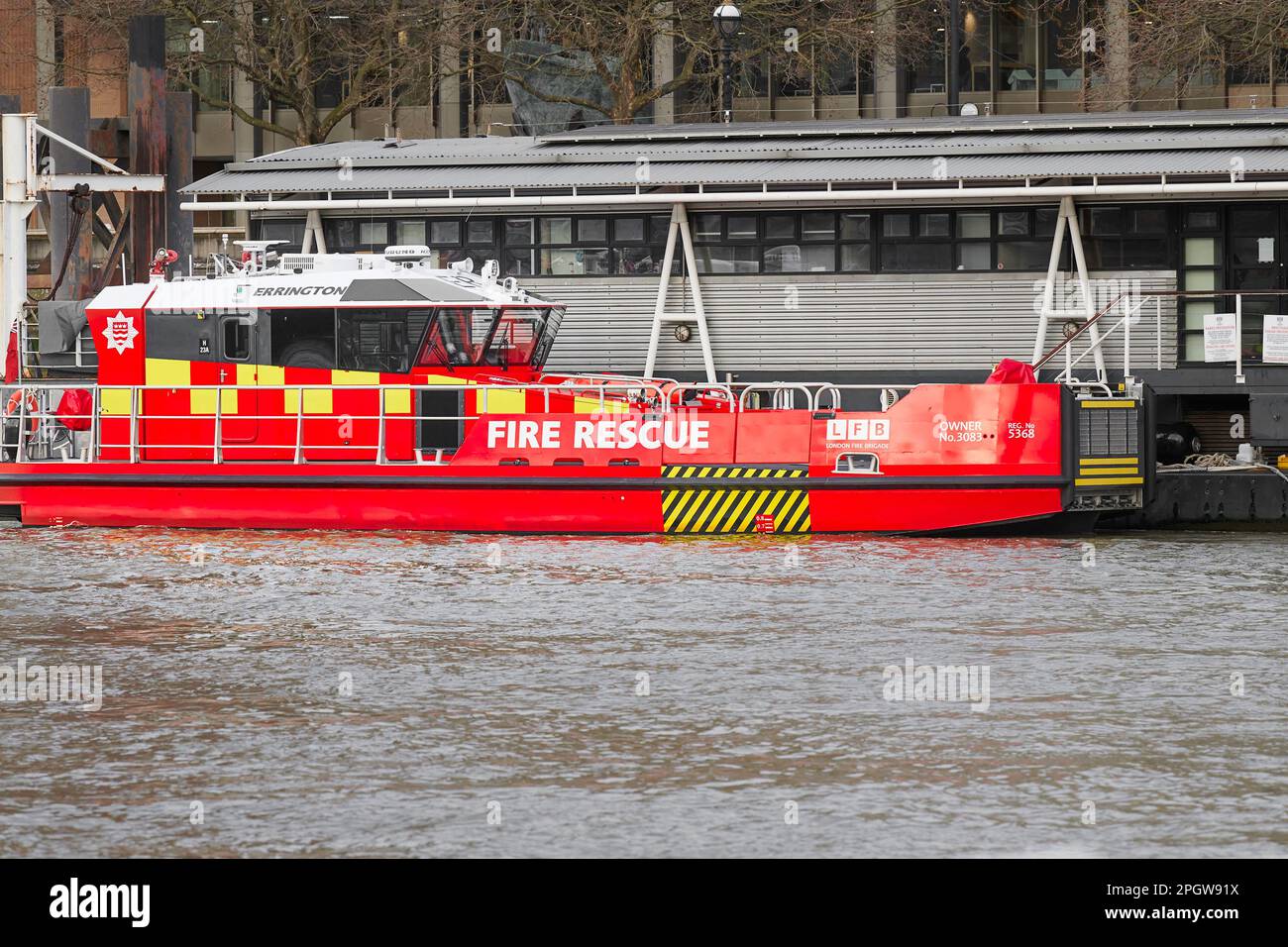 A fire rescue boat of the London Fire Brigade moored on a bank of the ...