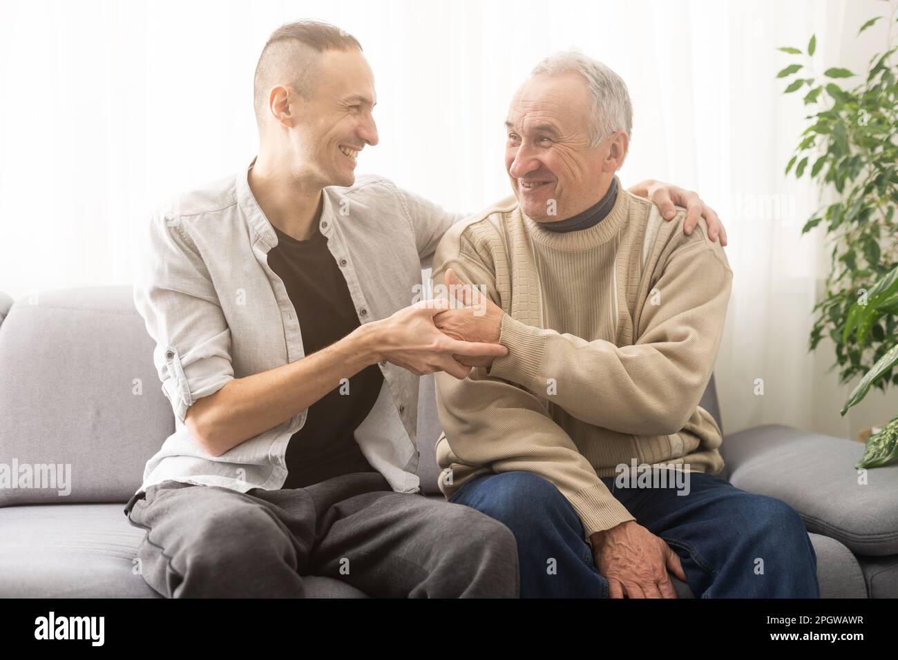 Happy two generations male family old senior mature father and smiling ...