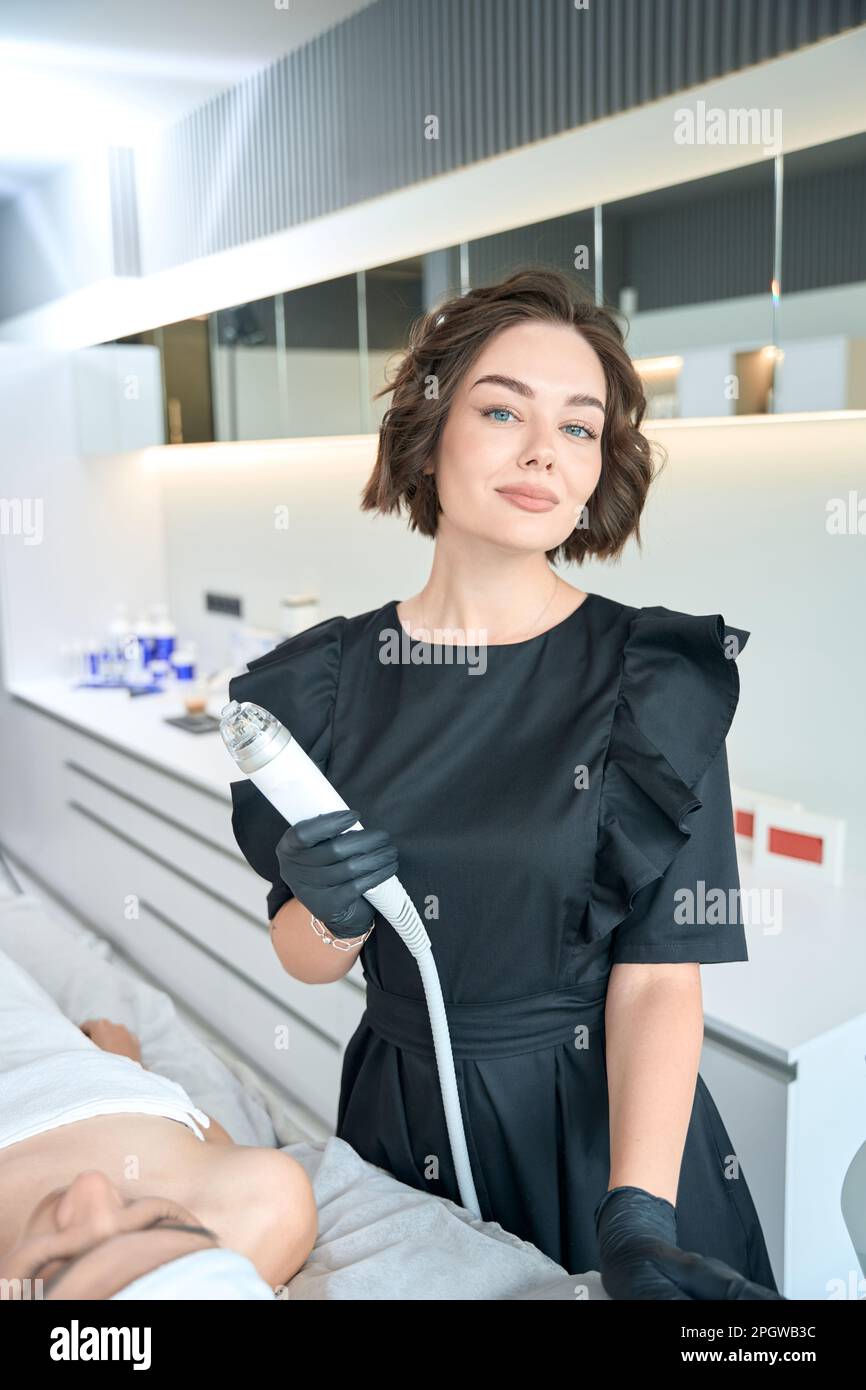 Dermatologist working and doing skin rejuvenation procedure Stock Photo ...