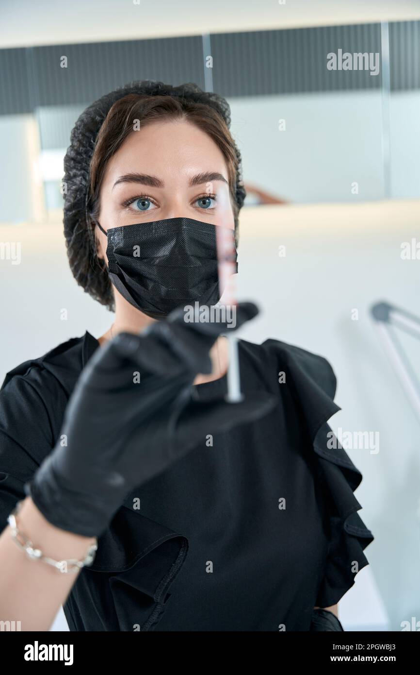 Portrait of pretty cosmetologist working in beauty salon Stock Photo ...