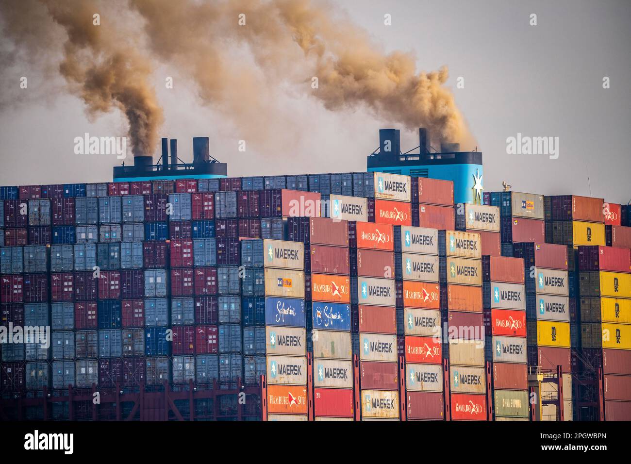 Container freighter Madison Maersk smoking ship's diesel stacks ...