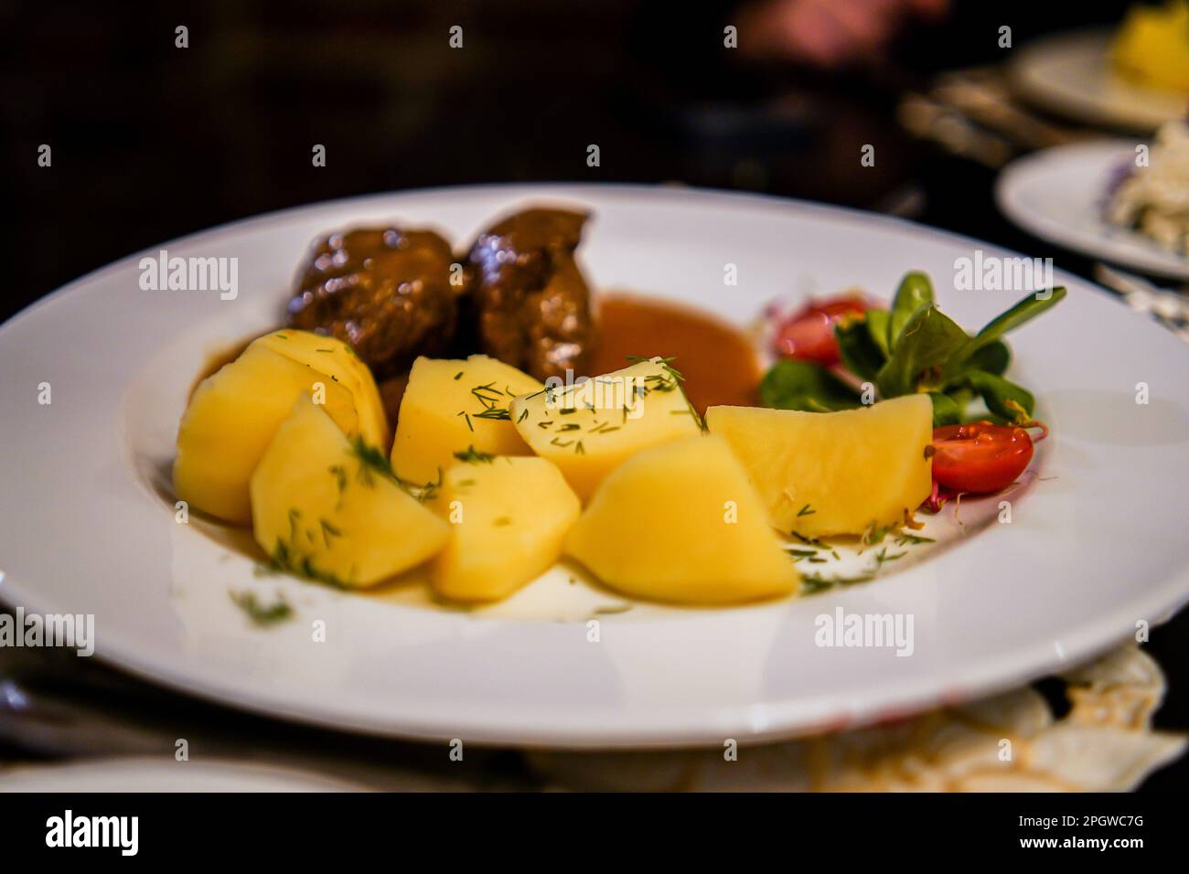 Freshly cooked potatoes garnished hi-res stock photography and images ...