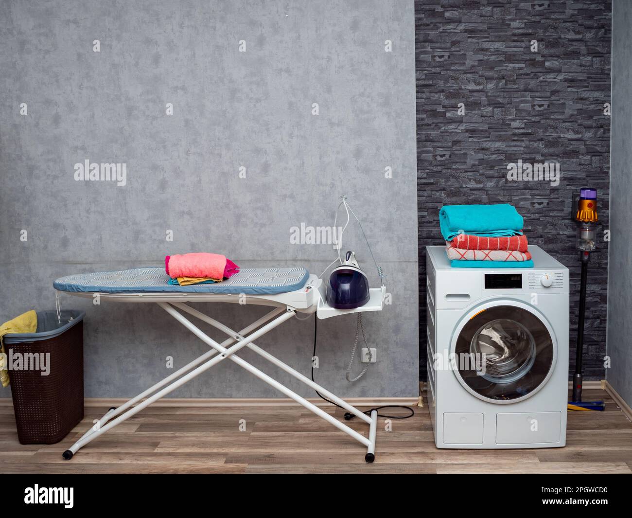 Laundry room interior with washing machine against the wall. Modern ...