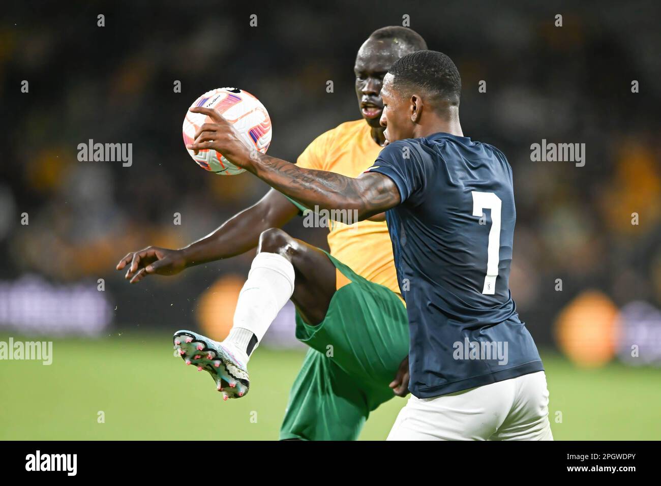 Sydney, Australia. 24th Mar, 2023. Awer Mabil (L) of Australia National ...