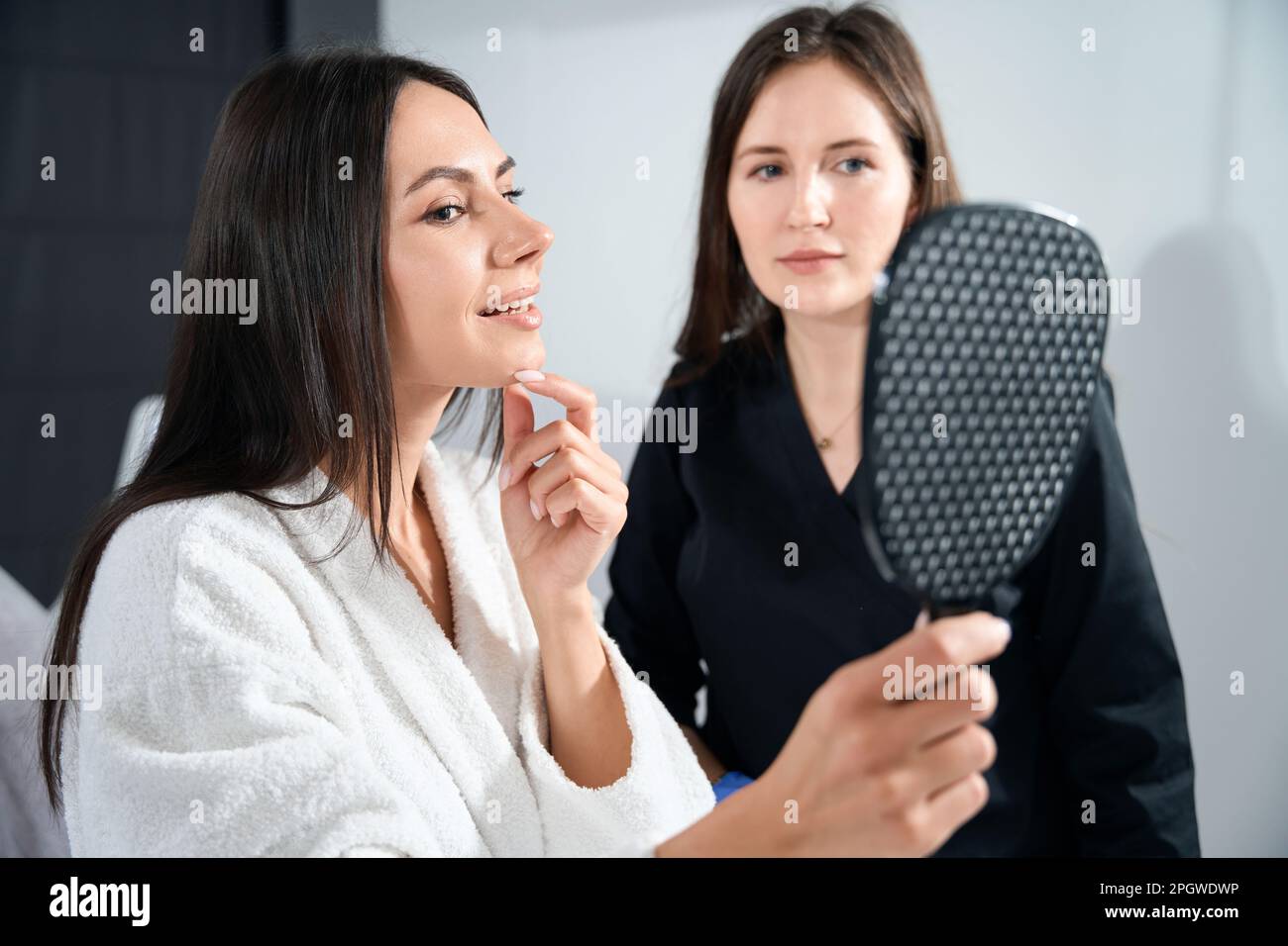 Looking at complexion mirror look hi-res stock photography and images ...