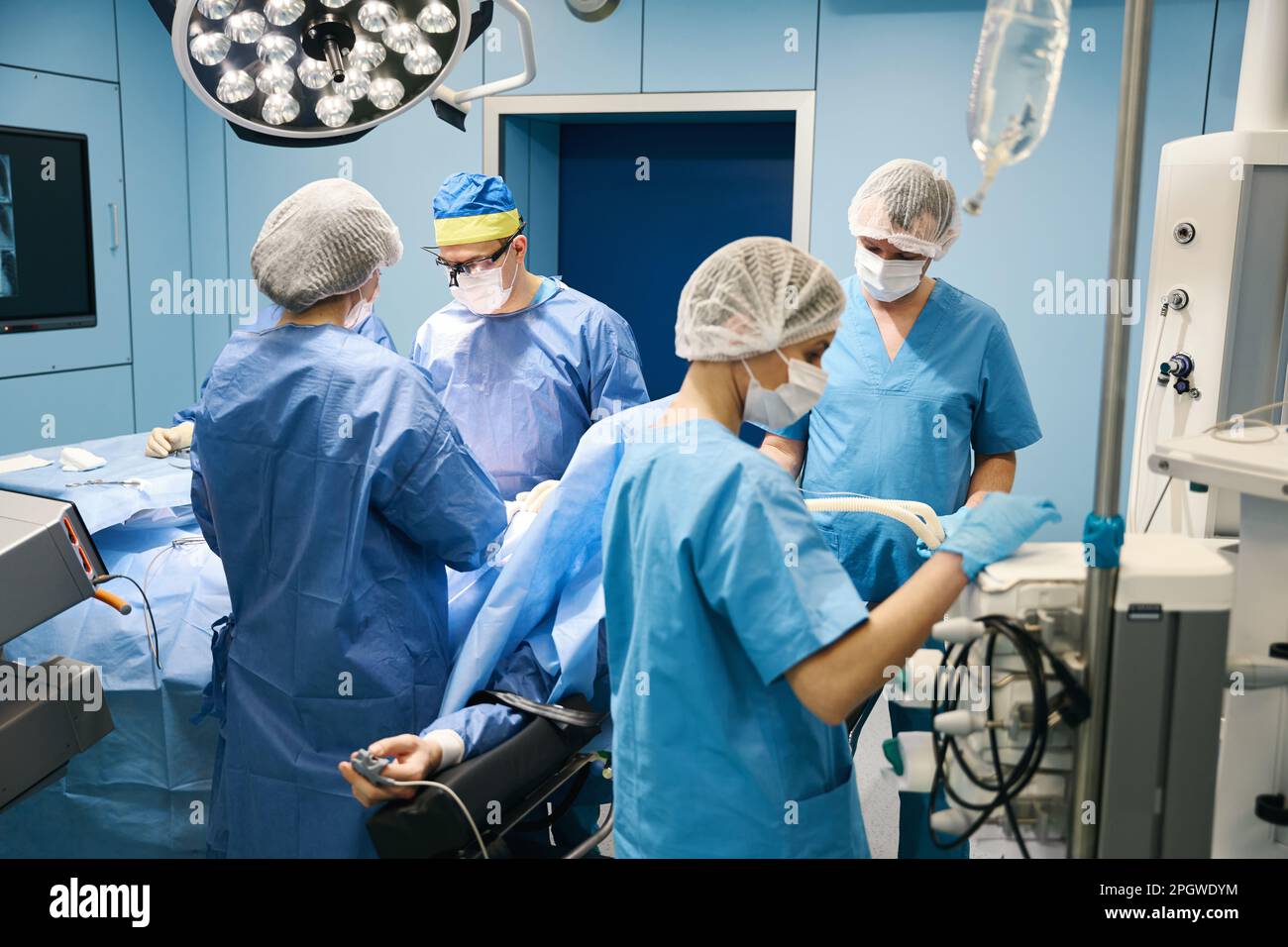 Surgical team performs an operation in a sterile operating room Stock ...