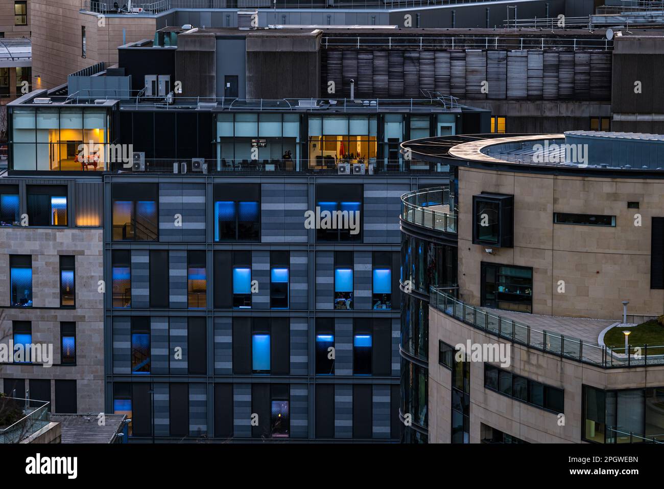Office building windows lit up at dusk or twilight, Edinburgh, Scotland ...
