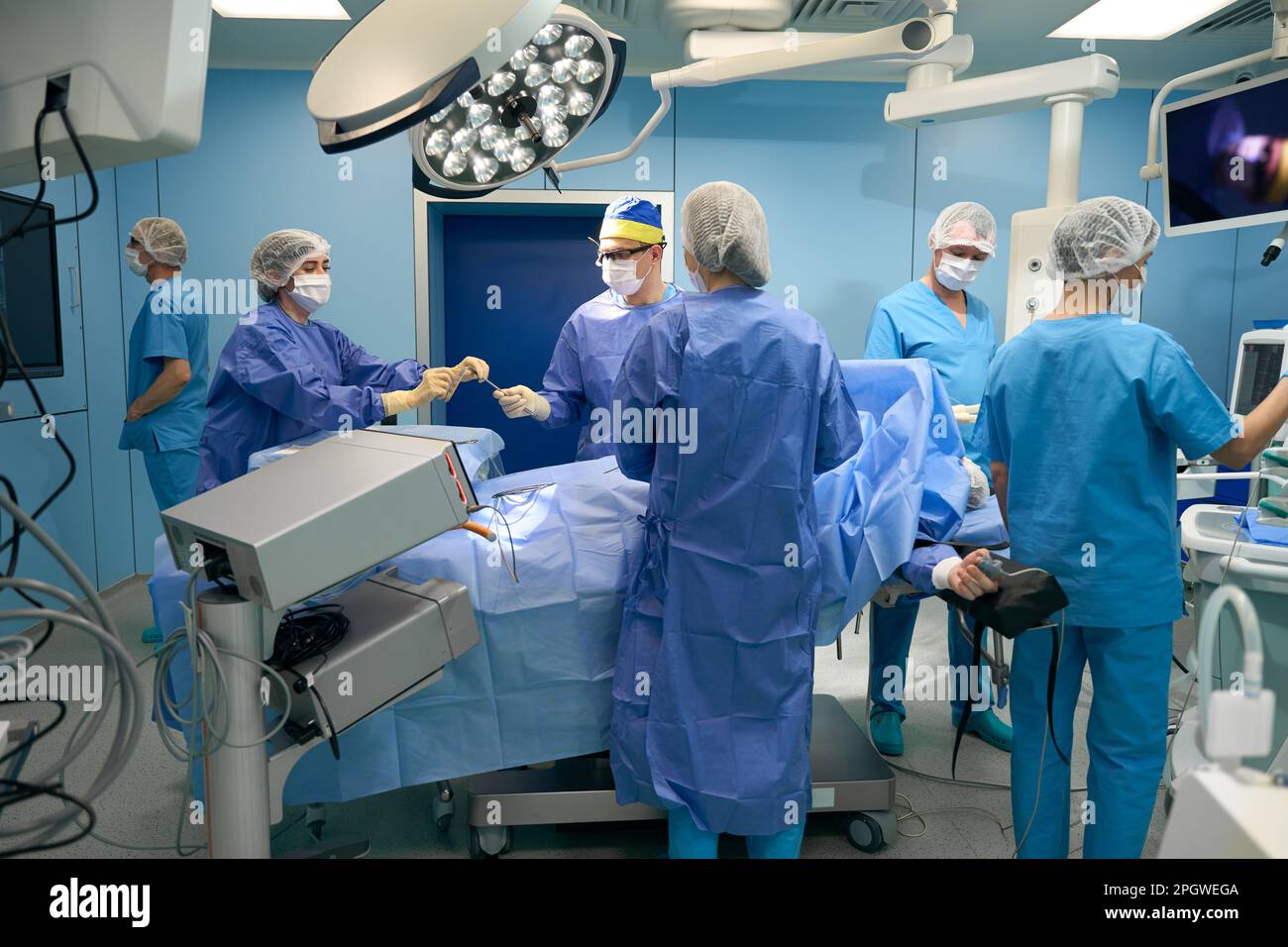 Operating room, teamwork doctors, anesthesiologist, assistants and ...