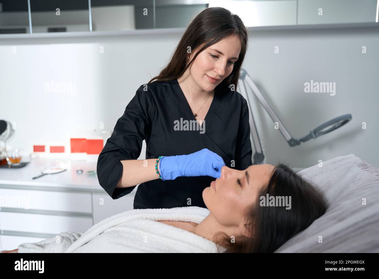 Medic doing face anti-aging injections in salon Stock Photo - Alamy