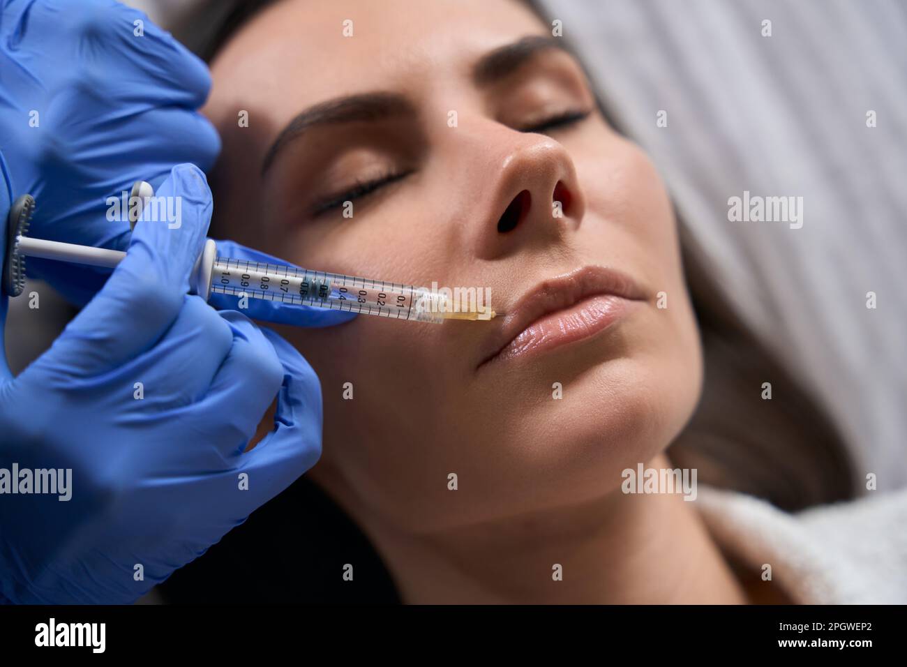 Lady doing anti-aging injections to beautiful client in salon Stock ...