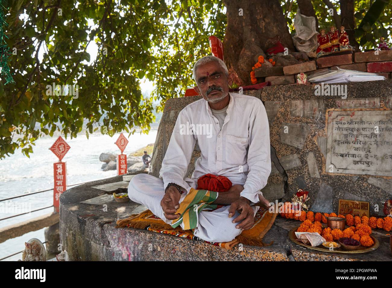 Haridwar, India - portrait of a sadhu sitting in the shade of a tree ...