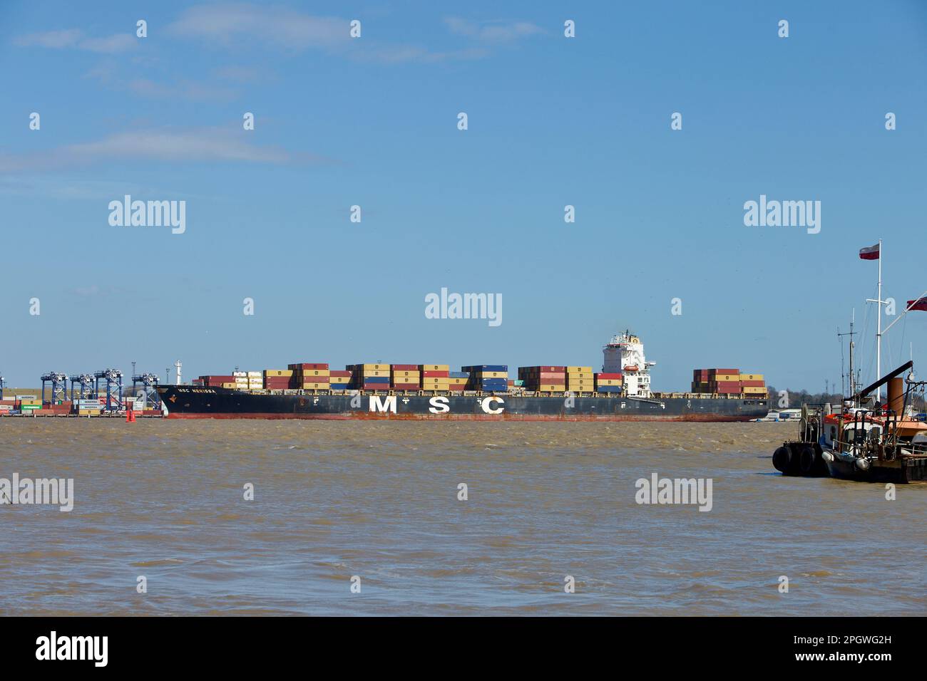 Container ship MSC Nerissa docking at the Port of Felixstowe, Suffolk ...